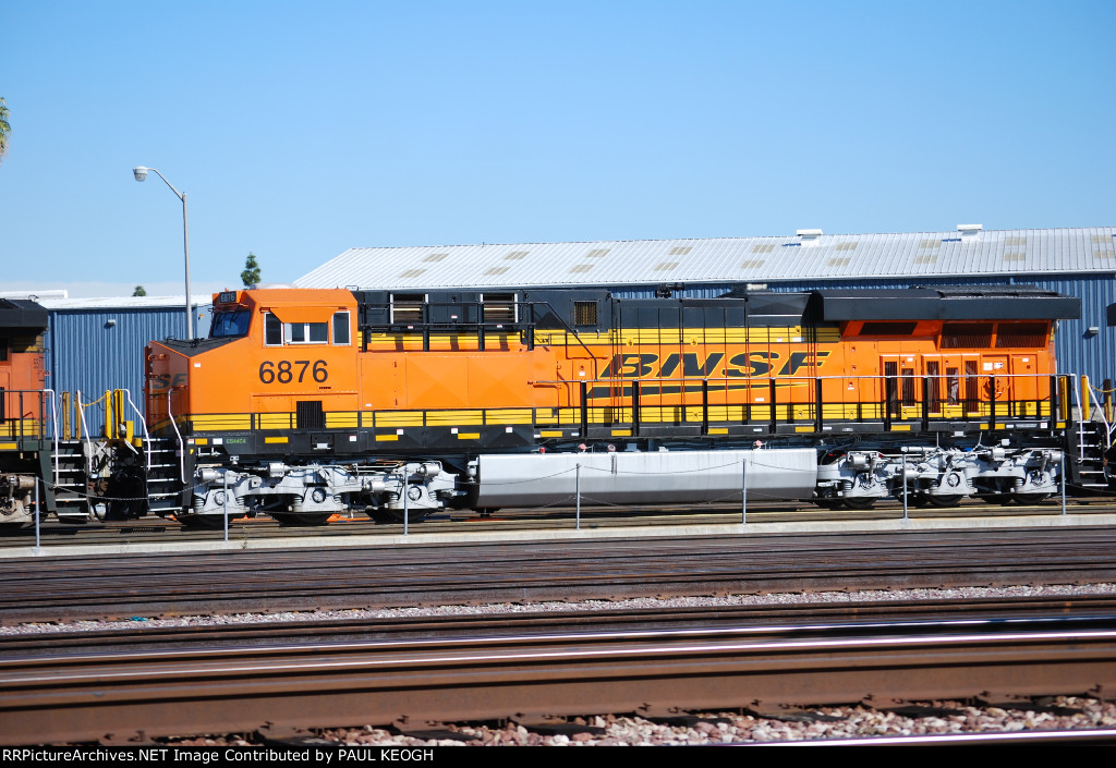 BNSF 6876 waits to head west towards the Hobart Yard to Hook up to an eastbound Stacker for a ...